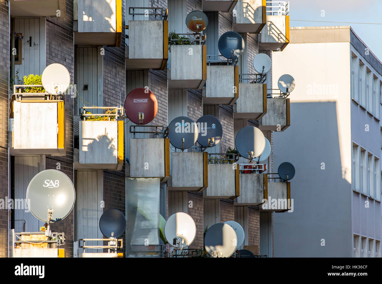 Many TV satellite antennas at a residential house, for TV reception ...