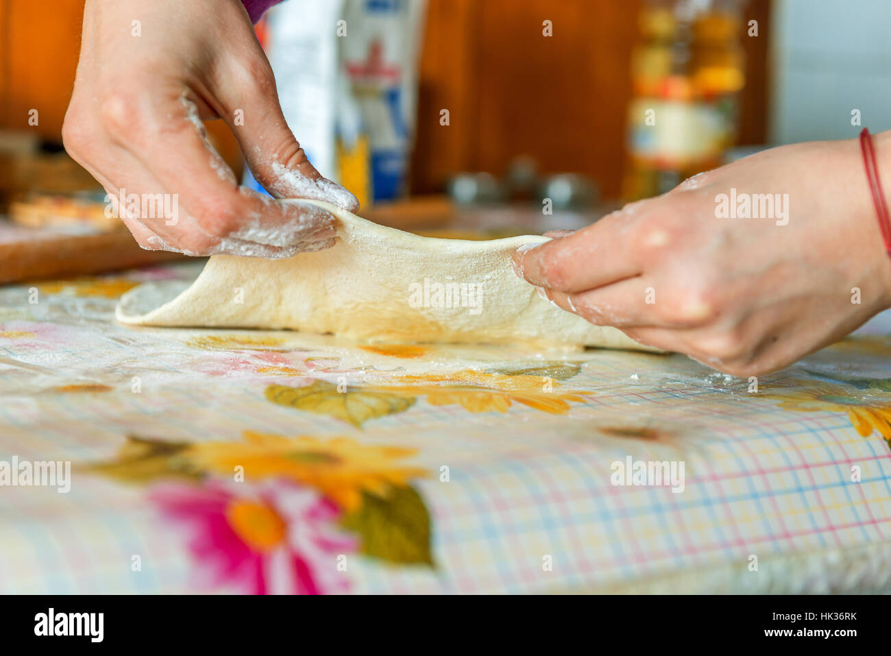 Woman hands kneading dough on the table at home Stock Photo - Alamy