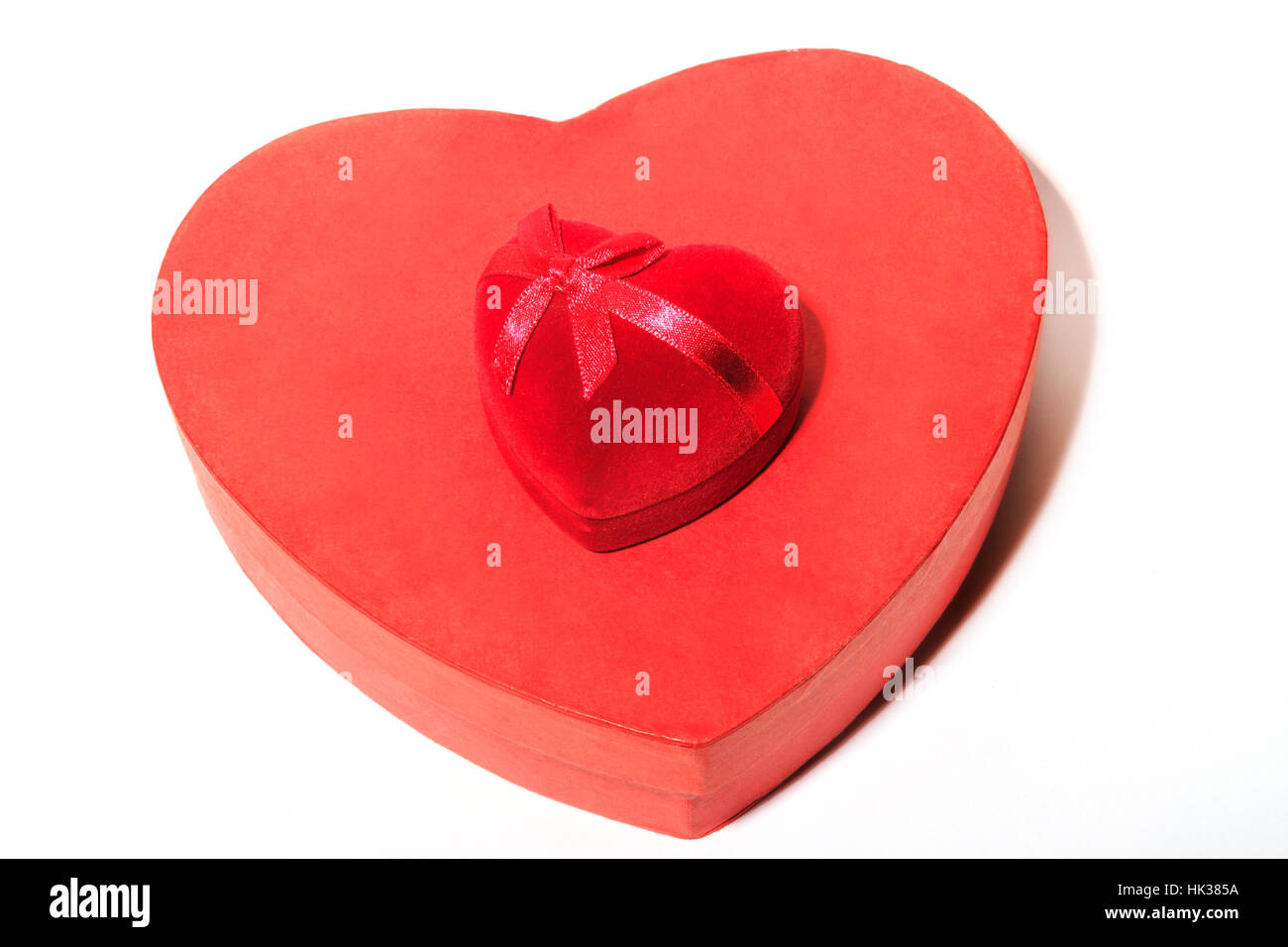 Gift love with a red heart is on the box in the shape of a red heart ...