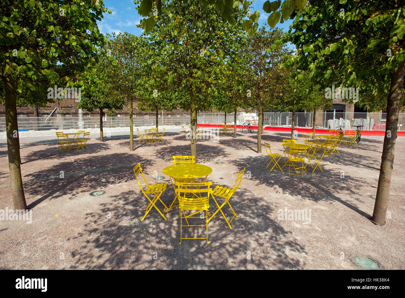 Trees and seating in Granery Square outside the old Kings cross gooods ...