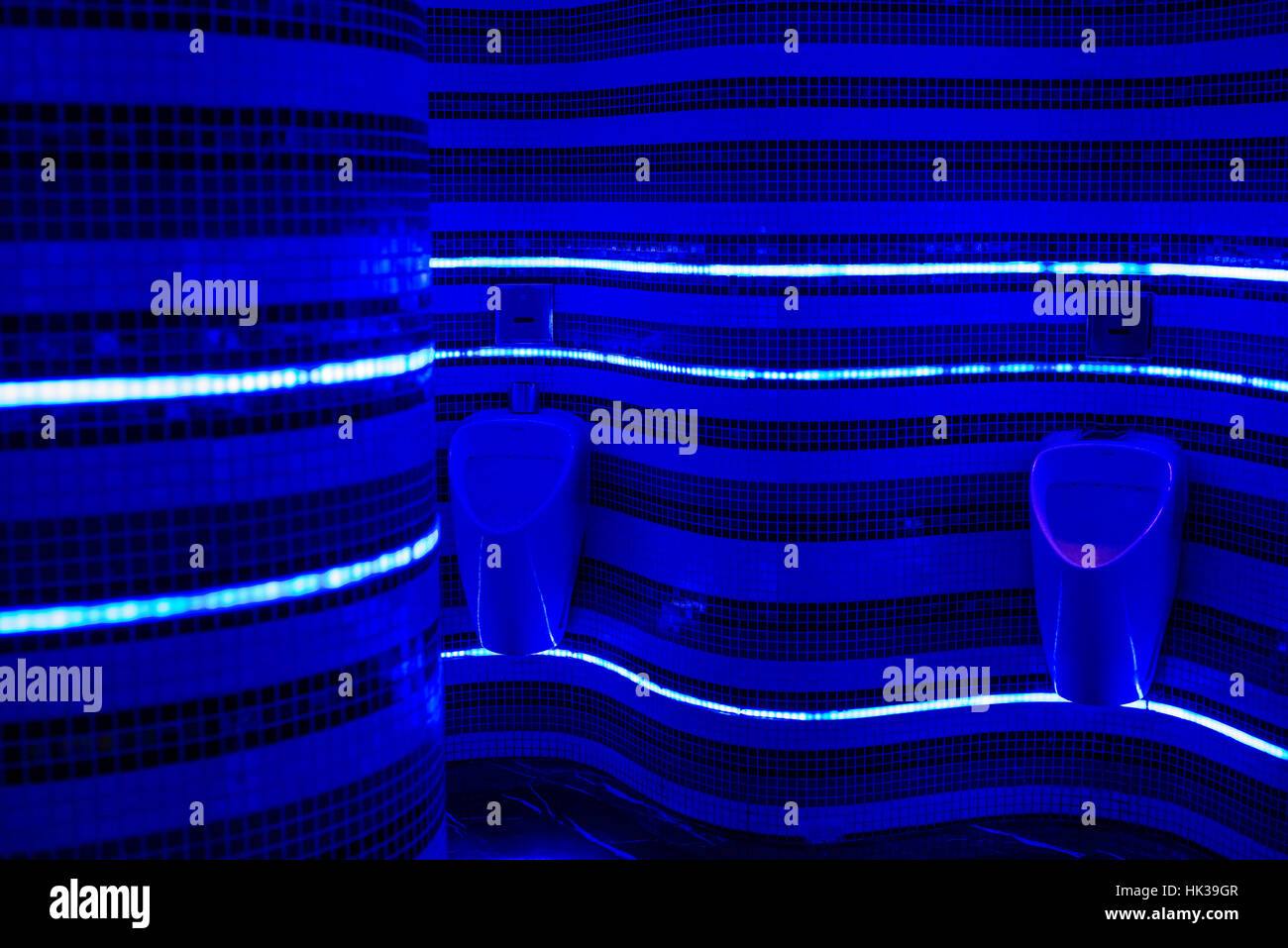 Urinals in nightclub bathroom, Saigon Stock Photo - Alamy