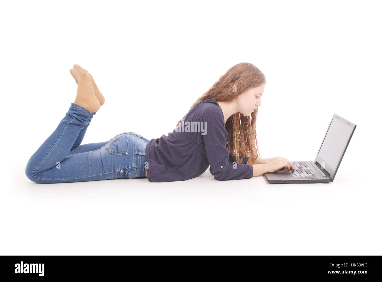 Student teenage girl lying sideways on the floor with laptop isolated ...