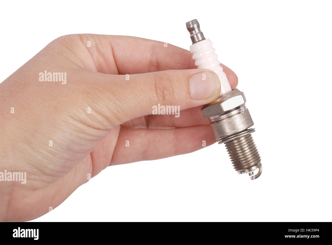 New sparking plug in a hand on a isolated white background. Photo with ...