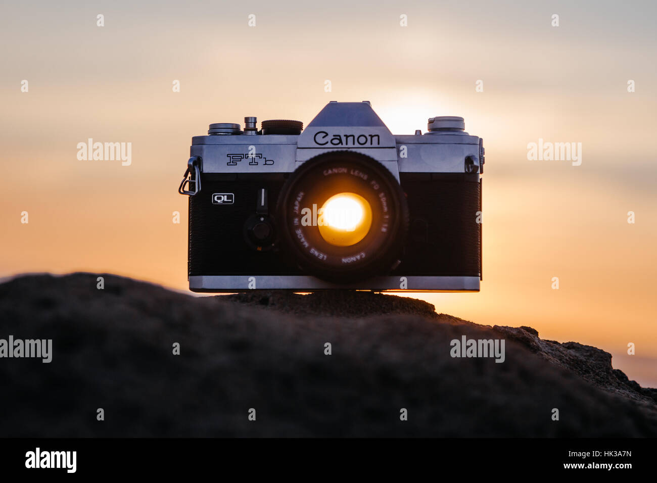 Sunset through Canon FTB lens, camera on a rock Stock Photo - Alamy