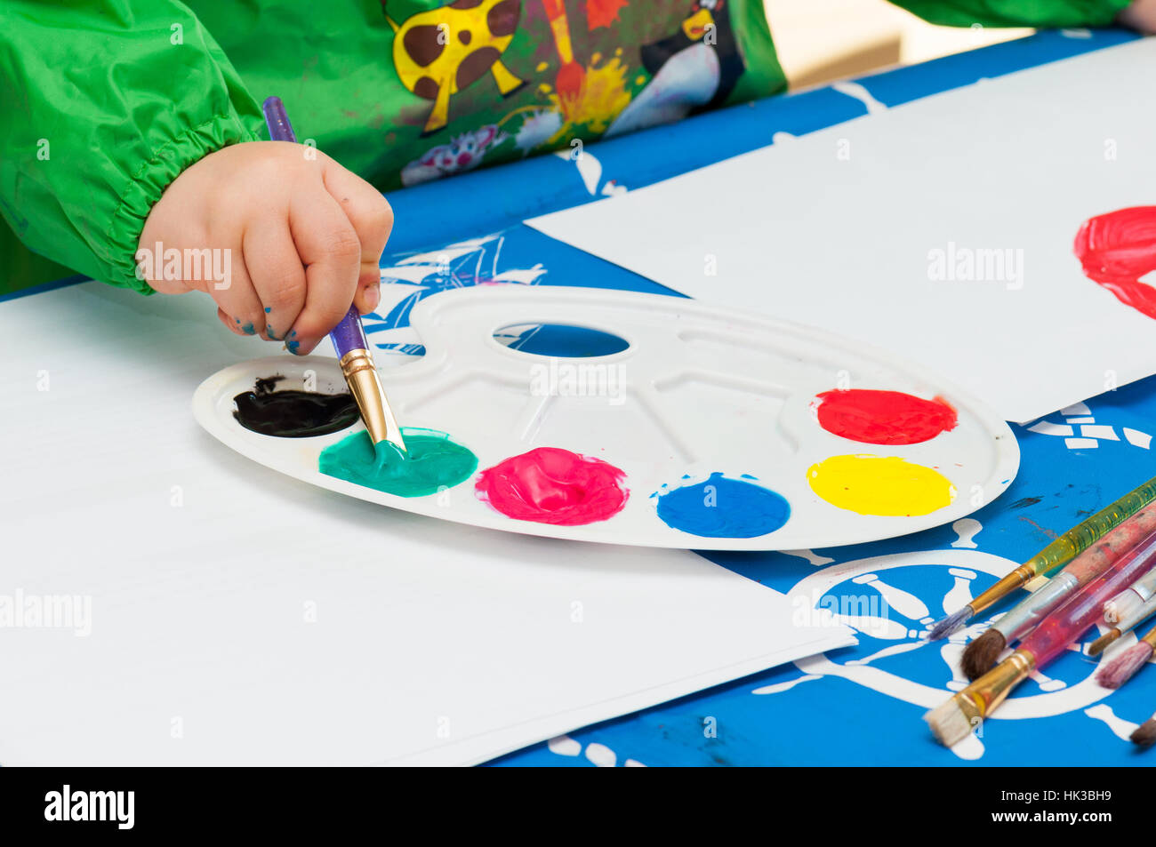 Hand of child painting with brush Stock Photo - Alamy