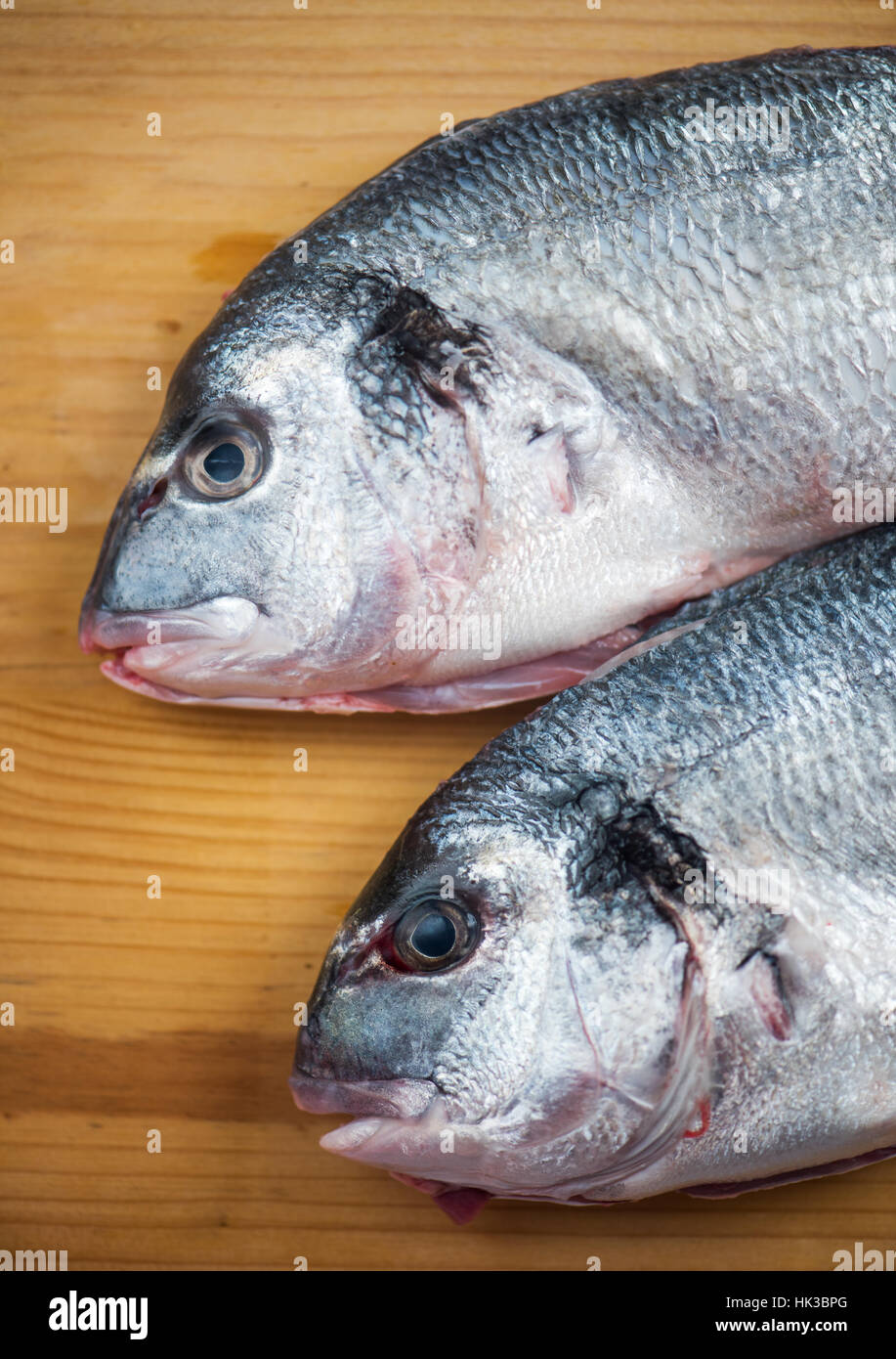 Two fishes ready for cooking close up Stock Photo - Alamy