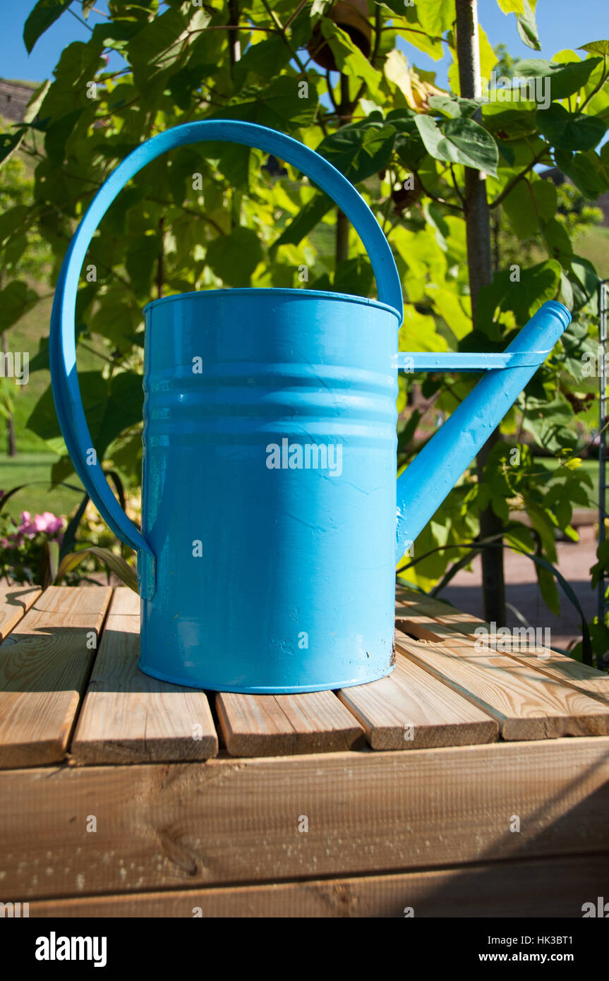 Blue watering can tool hi-res stock photography and images - Alamy