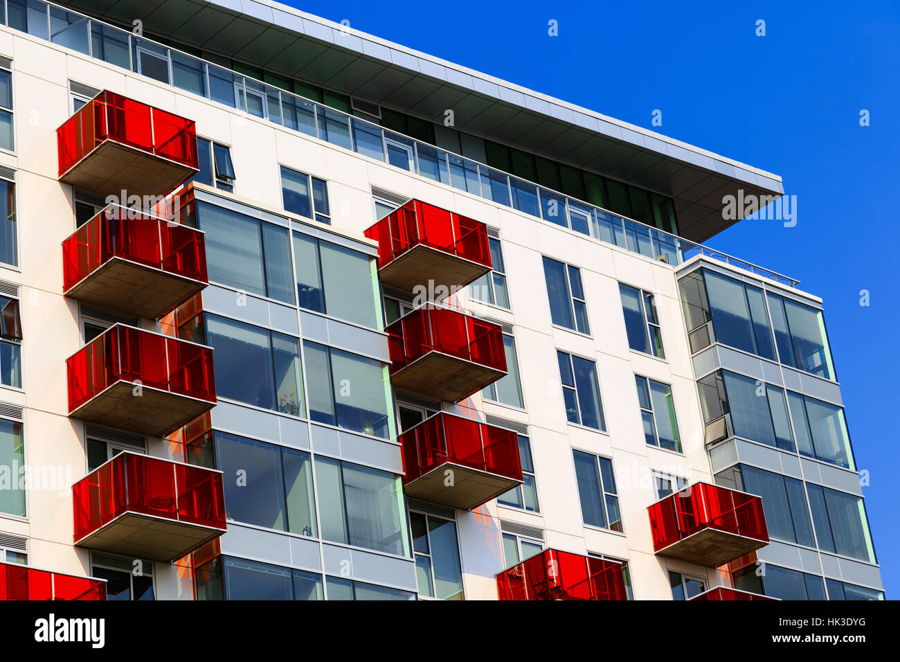 Apartment building with red balconies Stock Photo - Alamy