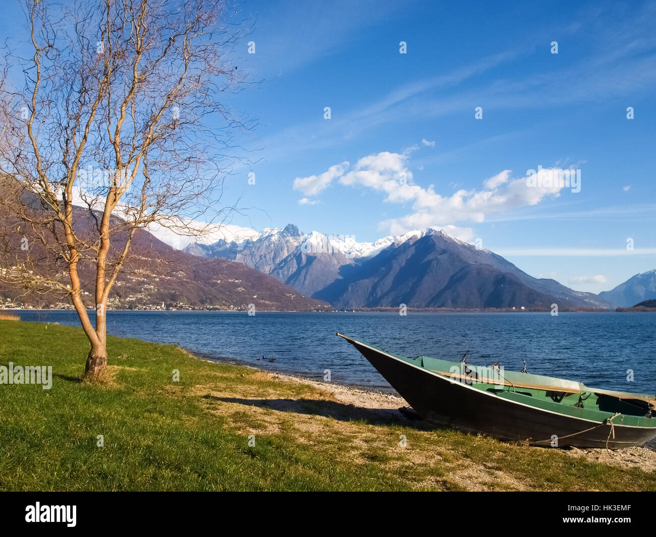 Lake of Como, Italy. Panorama of the lake and mountains from the beach ...
