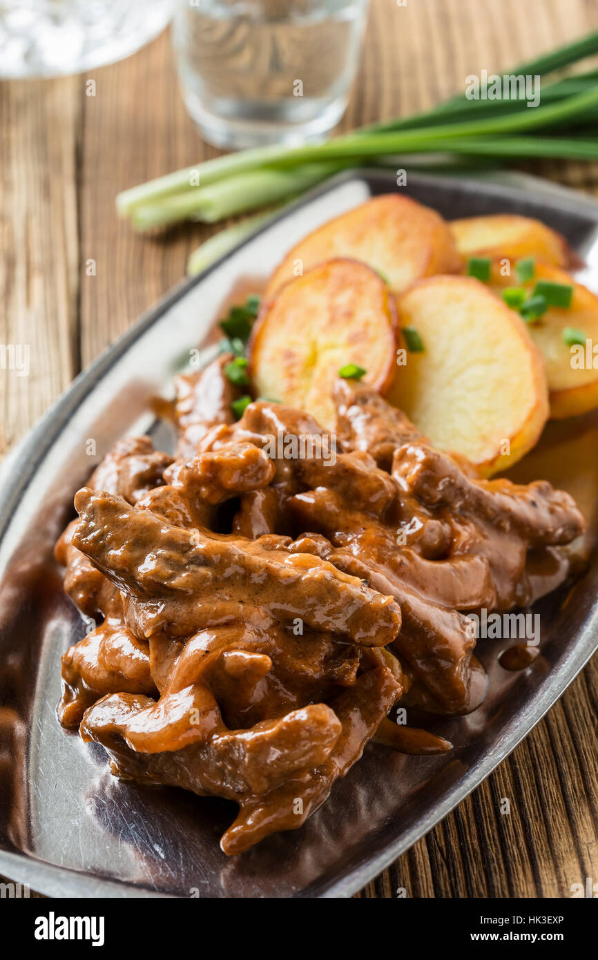 Beef Stroganoff, original recipe of russian dish. Thin strips of beef ...