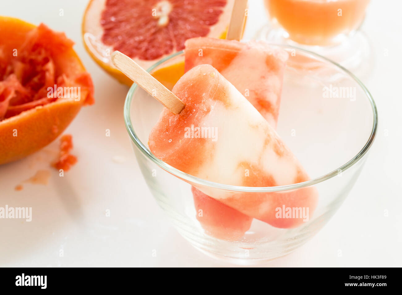 Homemade yogurt ice pops with fresh grapefruit juice for hot summer ...