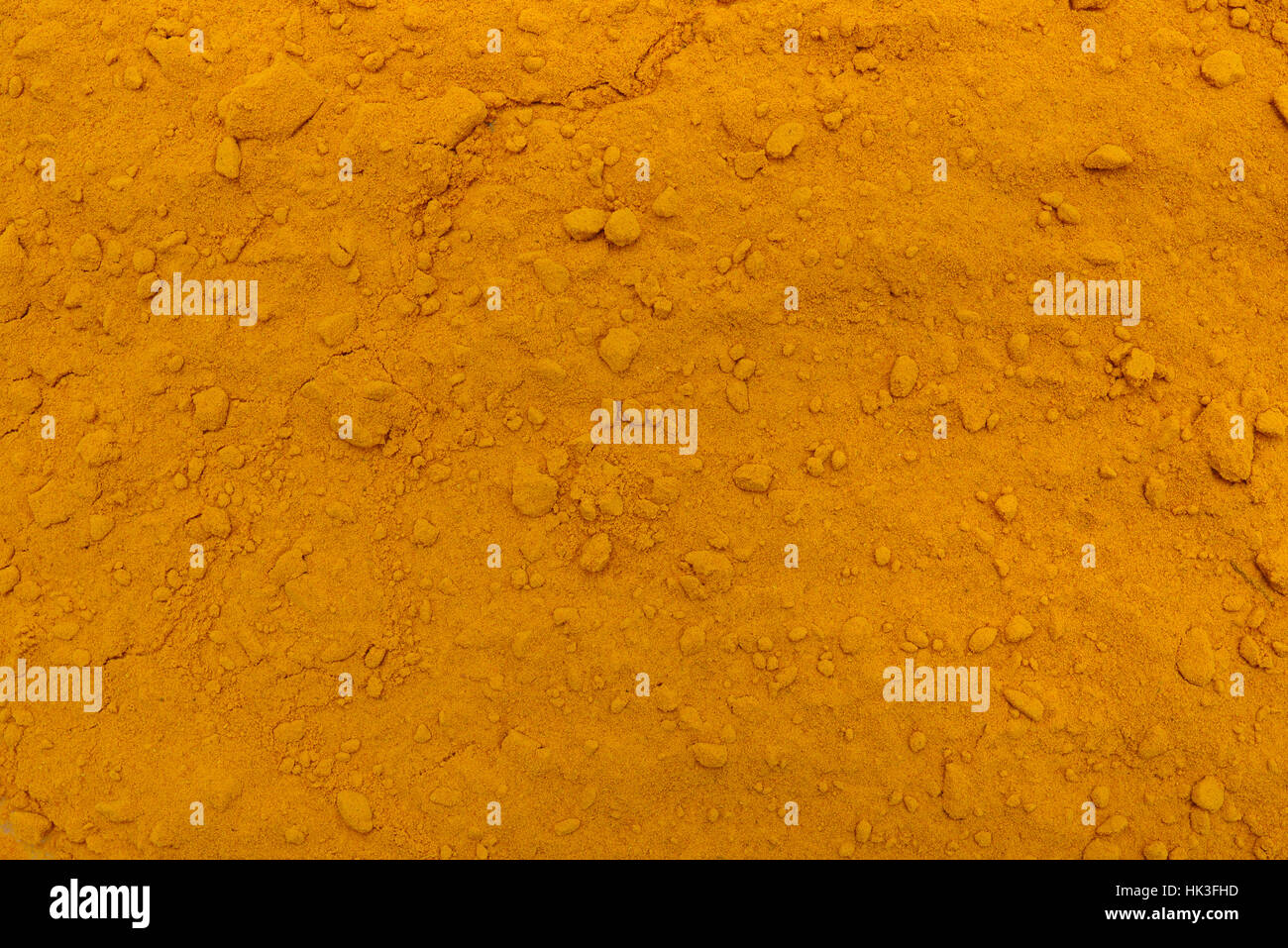 indian spice turmeric powder texture pattern background Stock Photo - Alamy