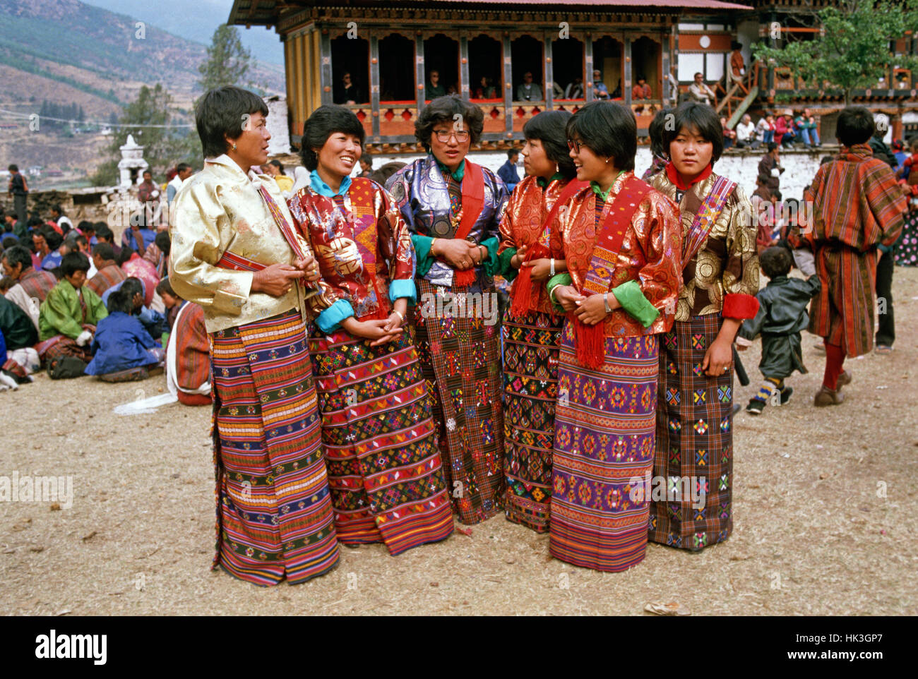 Bhutanese women in traditional costumes at at the Paro Tshechu, mask ...