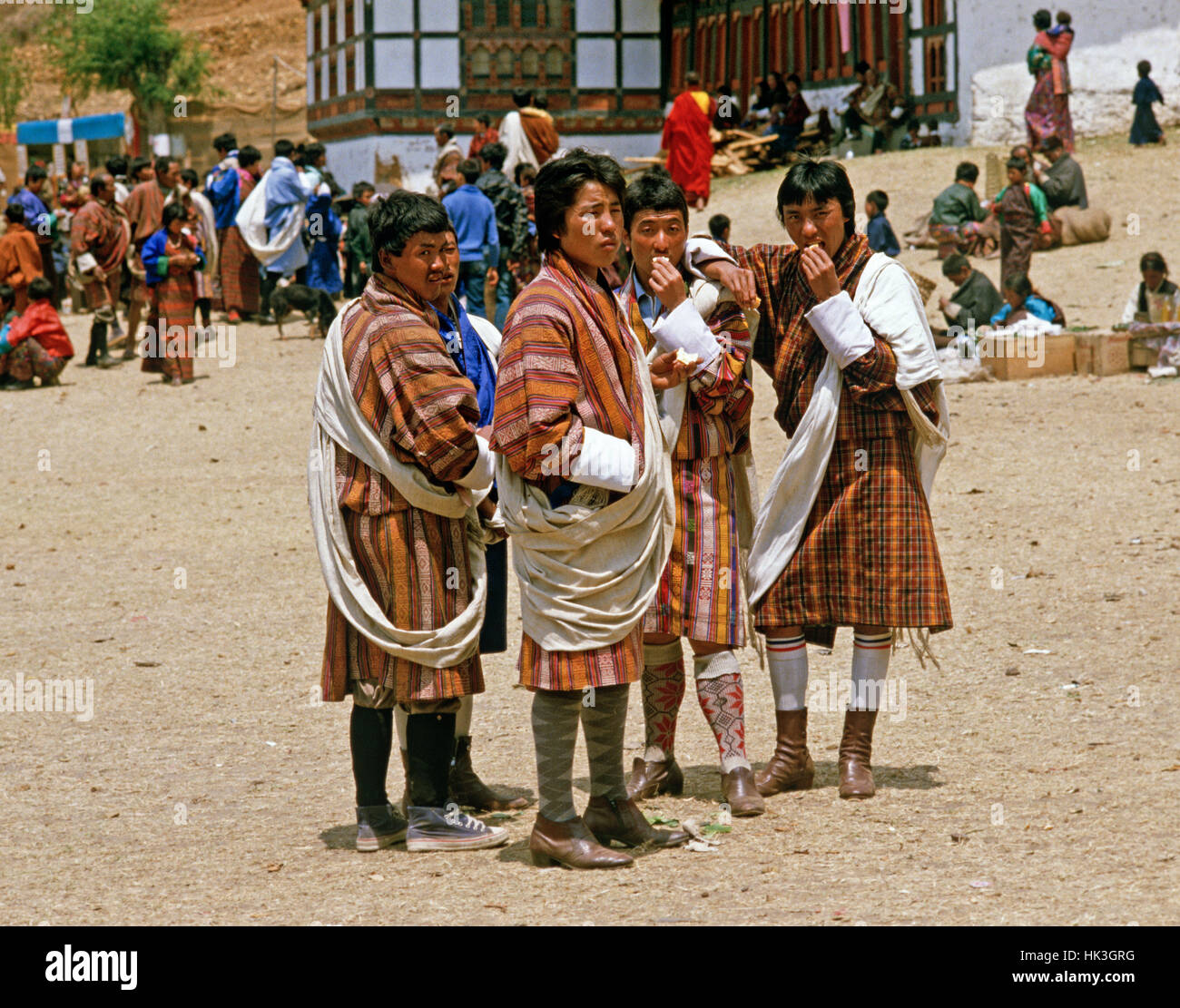 Bhutanese men in traditional costumes at at the Paro Tshechu, mask ...