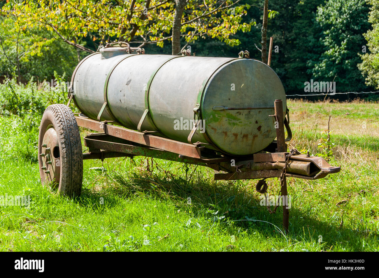 Metal cistern in a meadow Stock Photo - Alamy