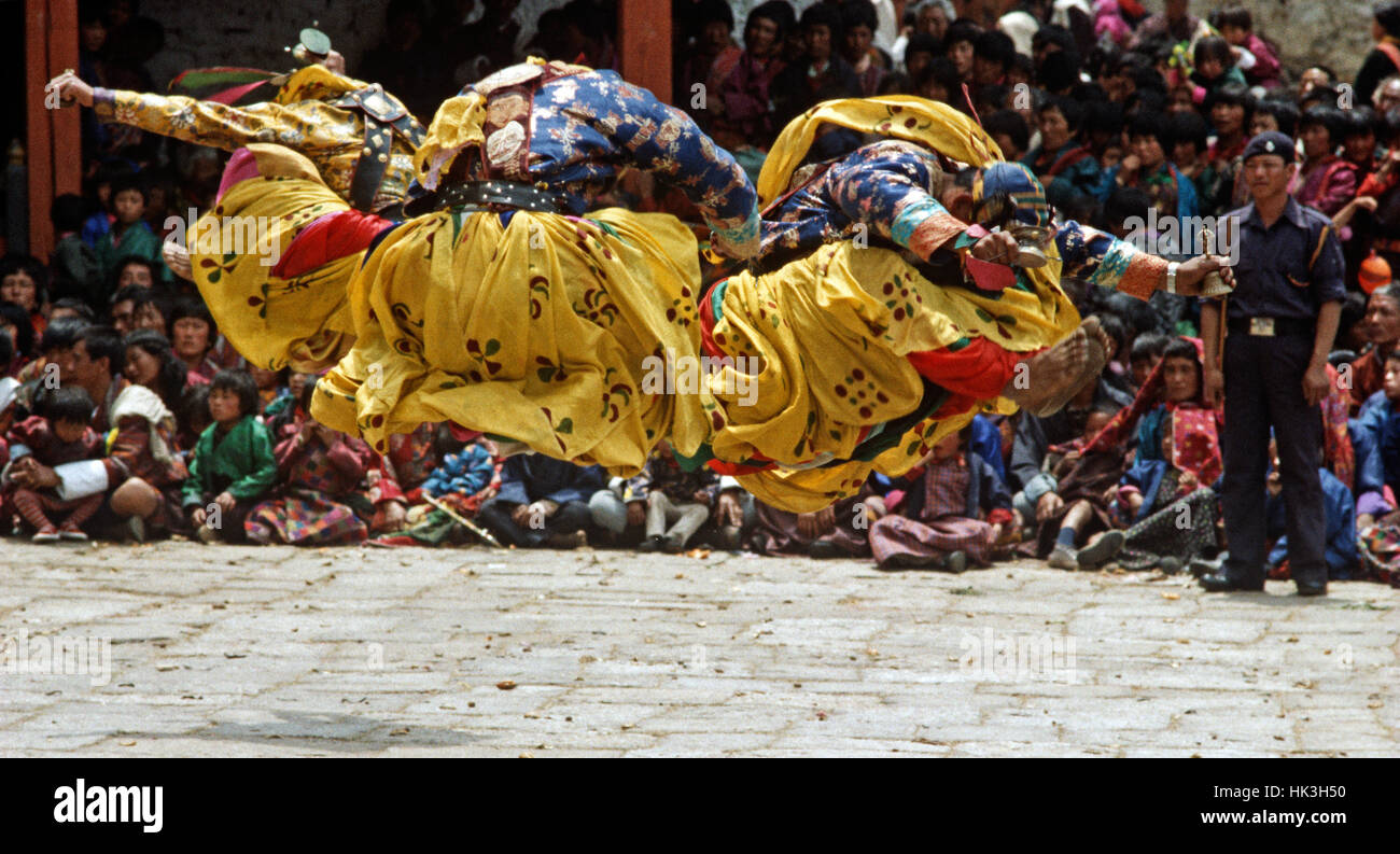 Bell dancers jumping at the Paro Tshechu, mask dance festival, in the ...