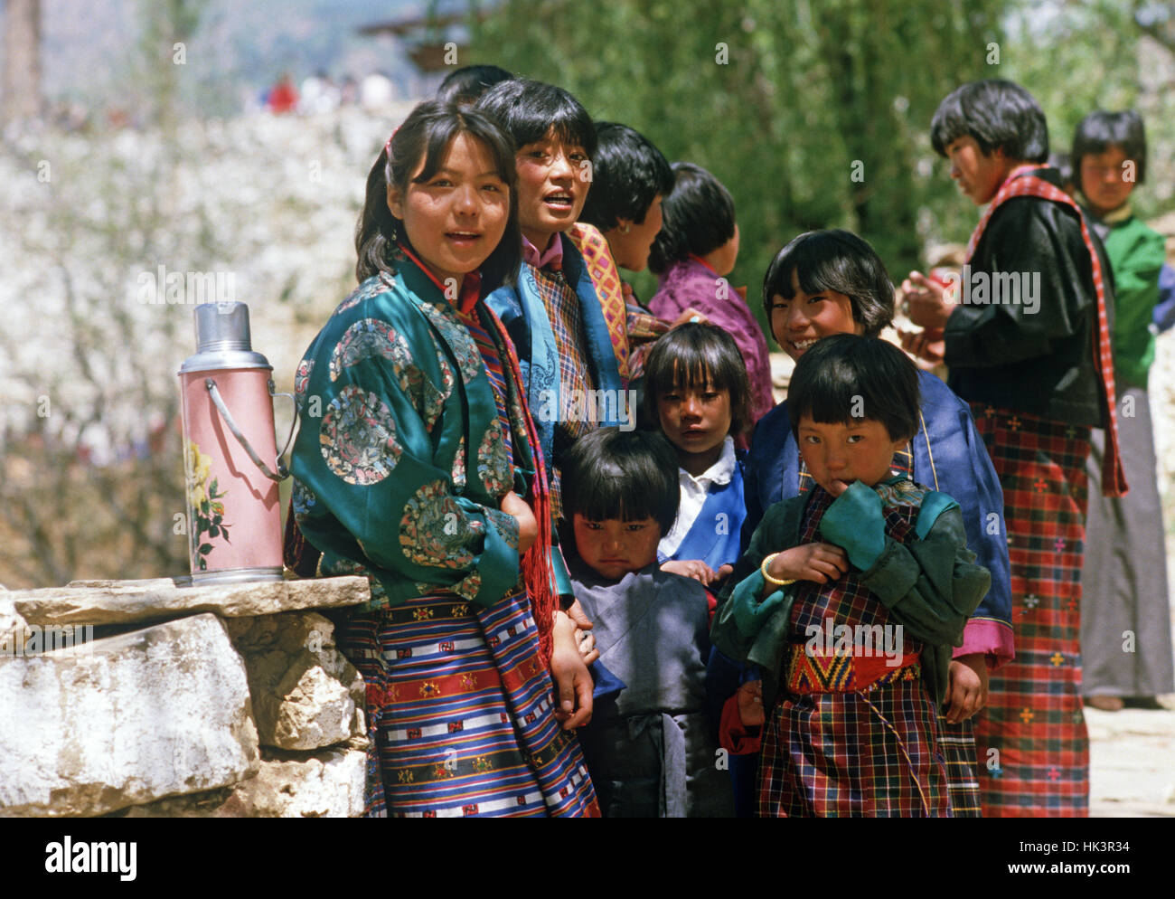 Bhutanese family in traditional costumes at at the Paro Tshechu, mask ...