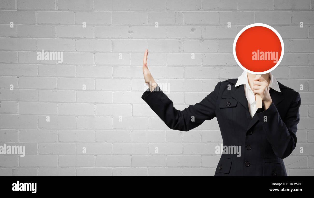 Unrecognizable businesswoman hiding her face behind mask hi-res stock ...