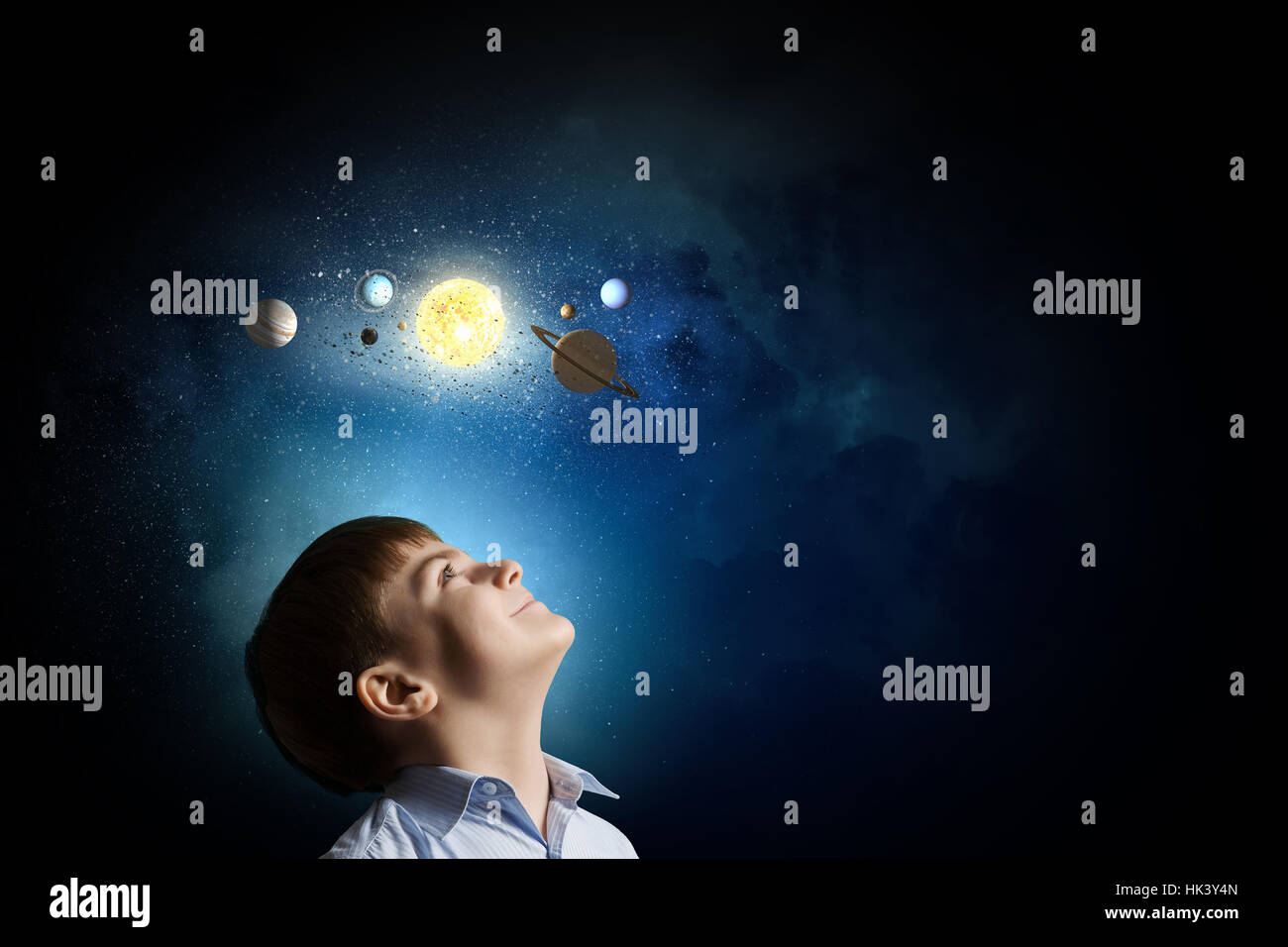 Cute boy of school age exploring space system hi-res stock photography ...