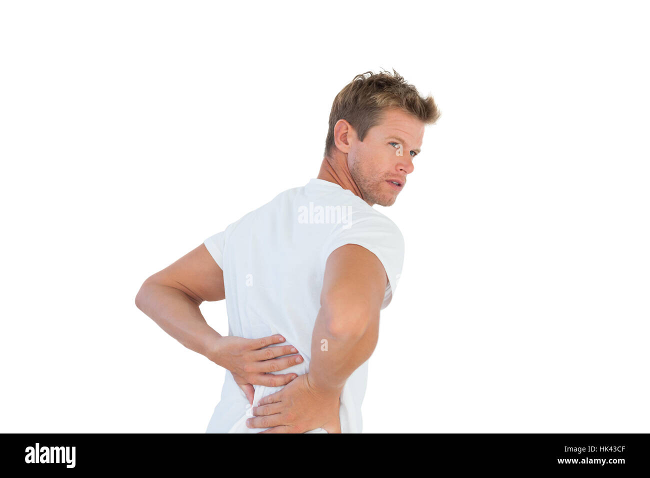 Handsome man suffering from back pain on white background Stock Photo ...