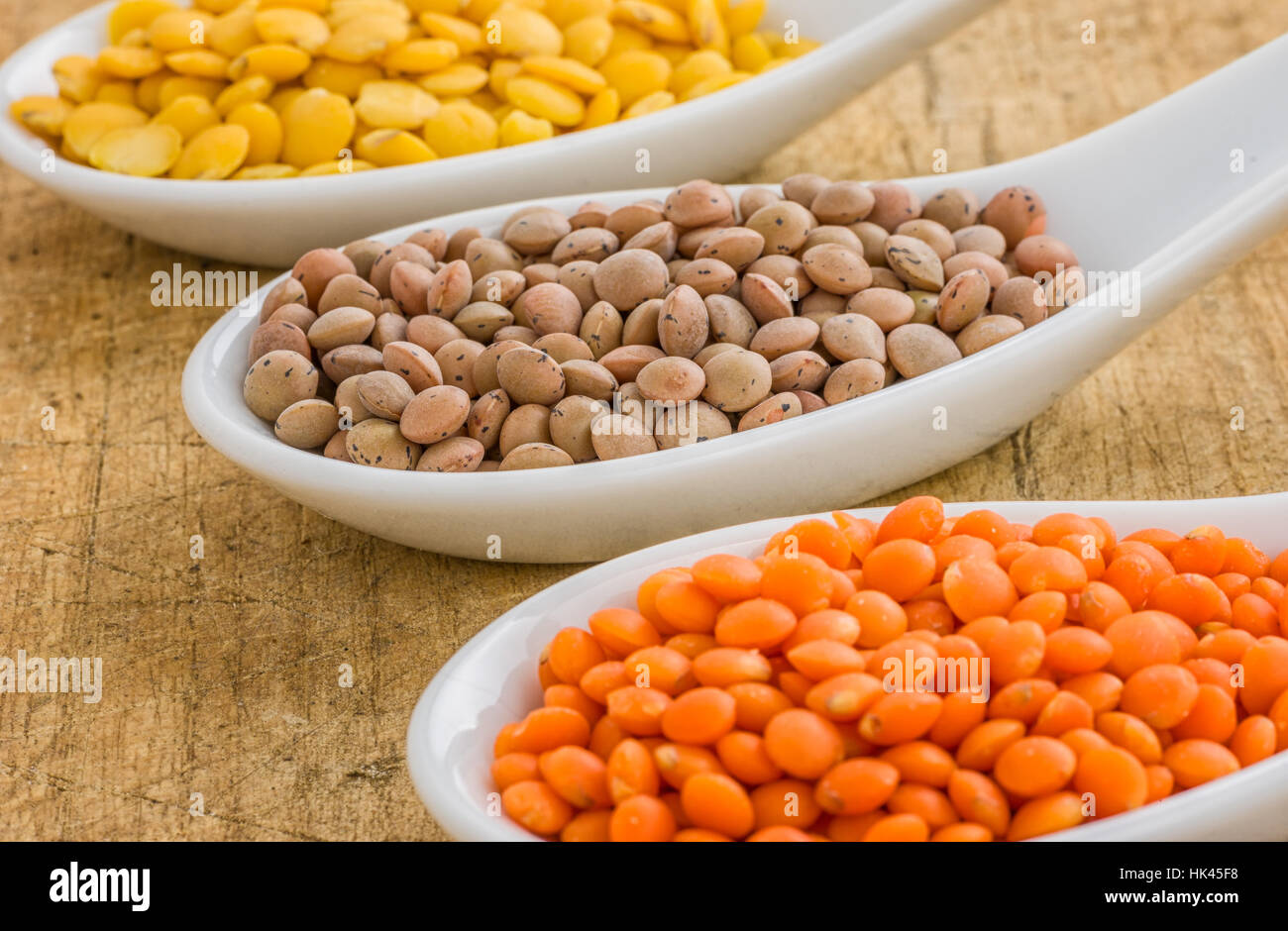 various types of lentils in porcelain spoons Stock Photo - Alamy