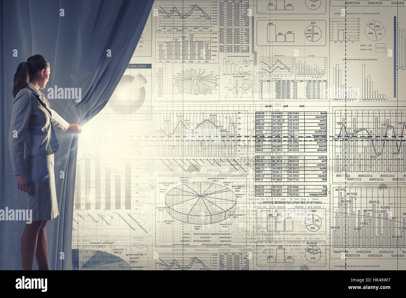 Young businesswoman opening curtain and presenting sales report hi-res ...