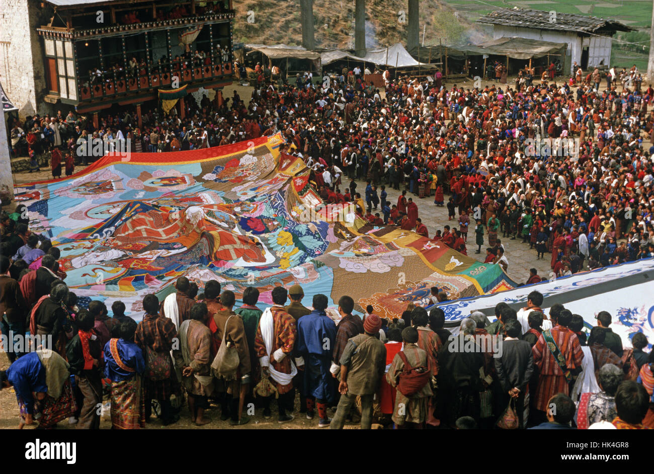Folding of the Thangka, a large tapestry, at the Paro Tshechu, mask ...