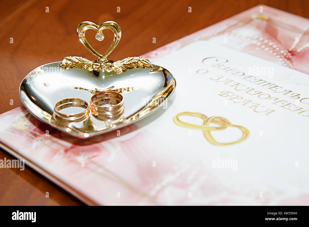 wedding rings and marriage certificate to the registration desk Stock ...