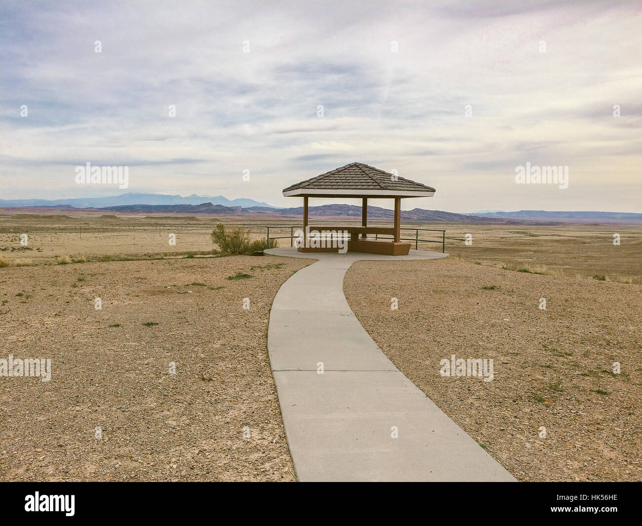 A concrete path leads to a covered kiosk overlooking a panoramic ...