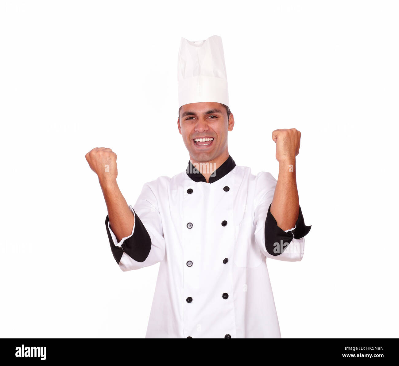 Portrait of a happy male chef showing winning gesture with hands on ...
