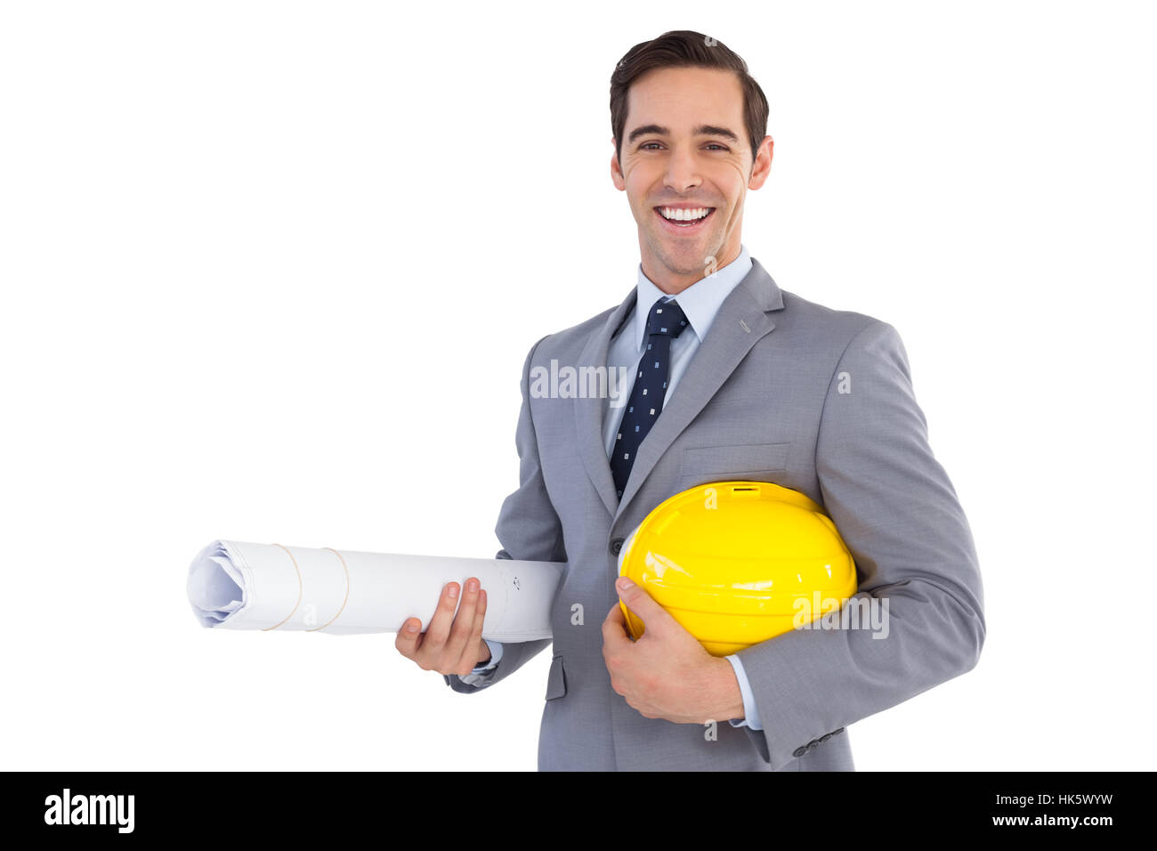 Happy architect holding plans and hard hat on white background Stock ...