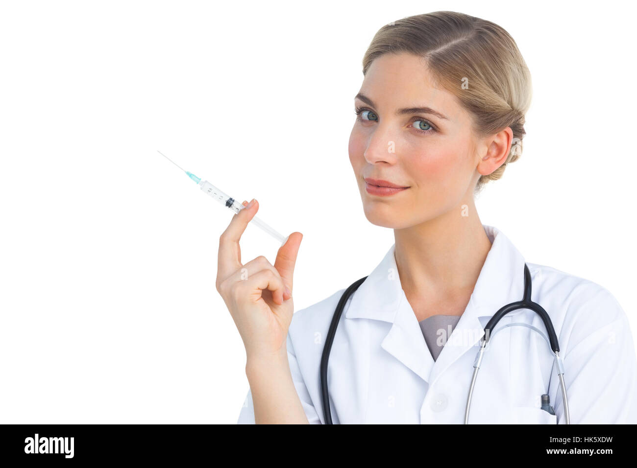Nurse holding syringe in her hand on white background Stock Photo - Alamy