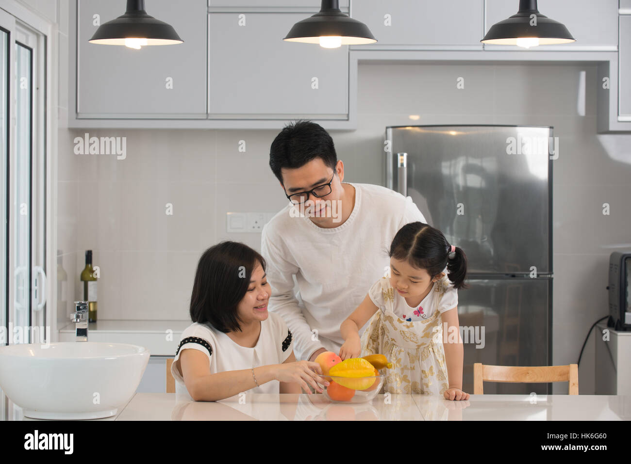 asian family cooking at kitchen Stock Photo - Alamy