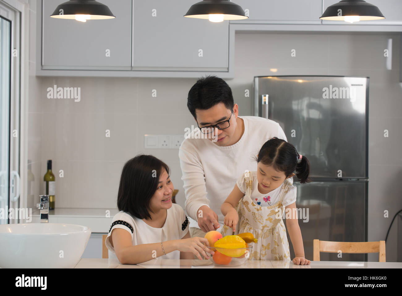 asian family cooking at kitchen Stock Photo - Alamy