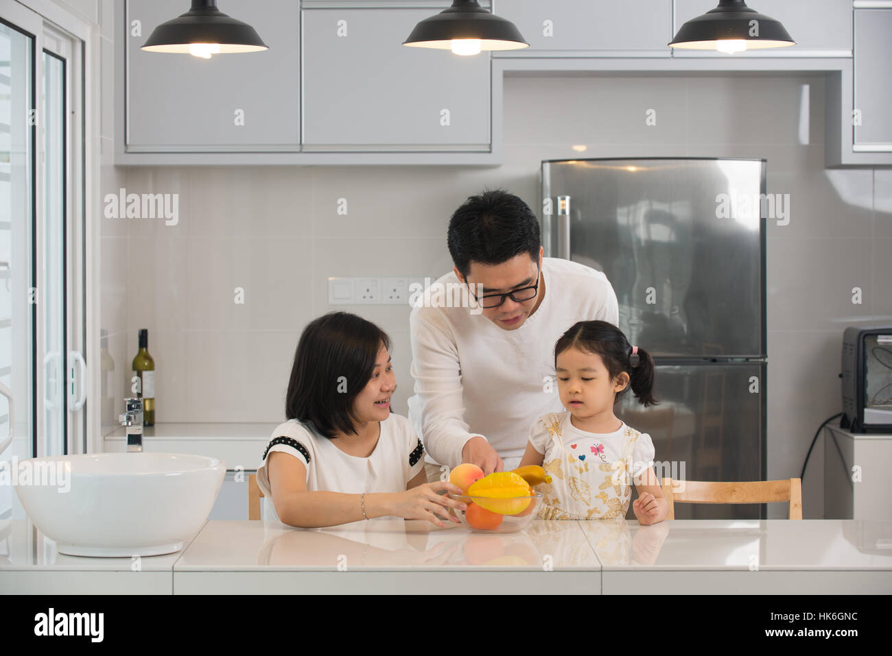 asian family cooking at kitchen Stock Photo - Alamy