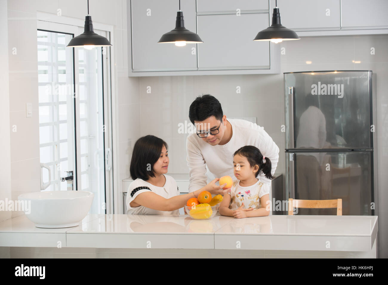 asian family cooking at kitchen Stock Photo - Alamy