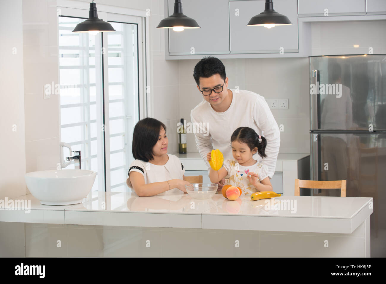 asian family cooking at kitchen Stock Photo - Alamy