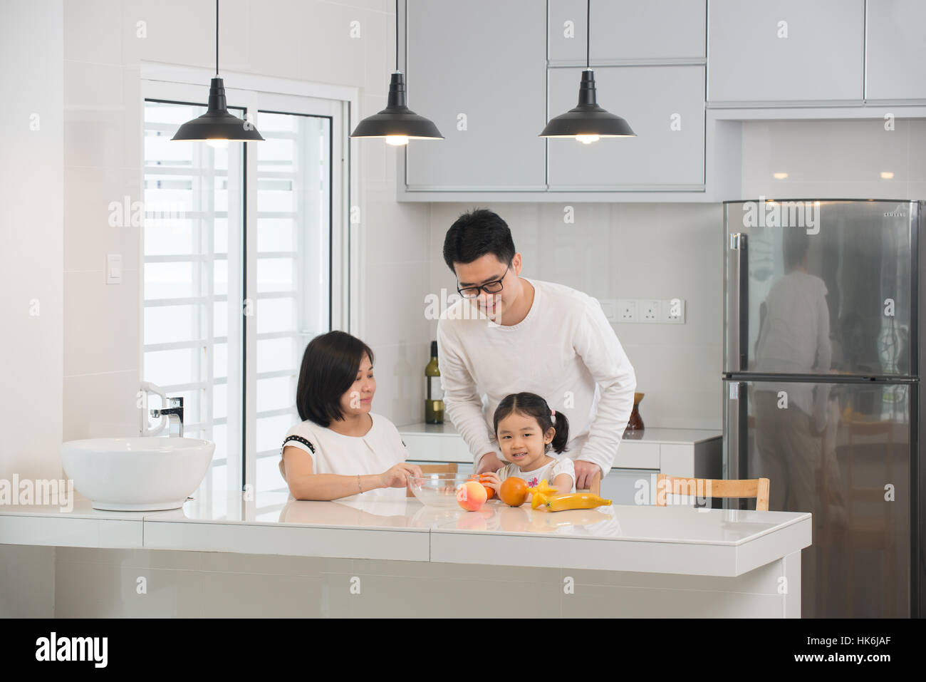 asian family cooking at kitchen Stock Photo - Alamy