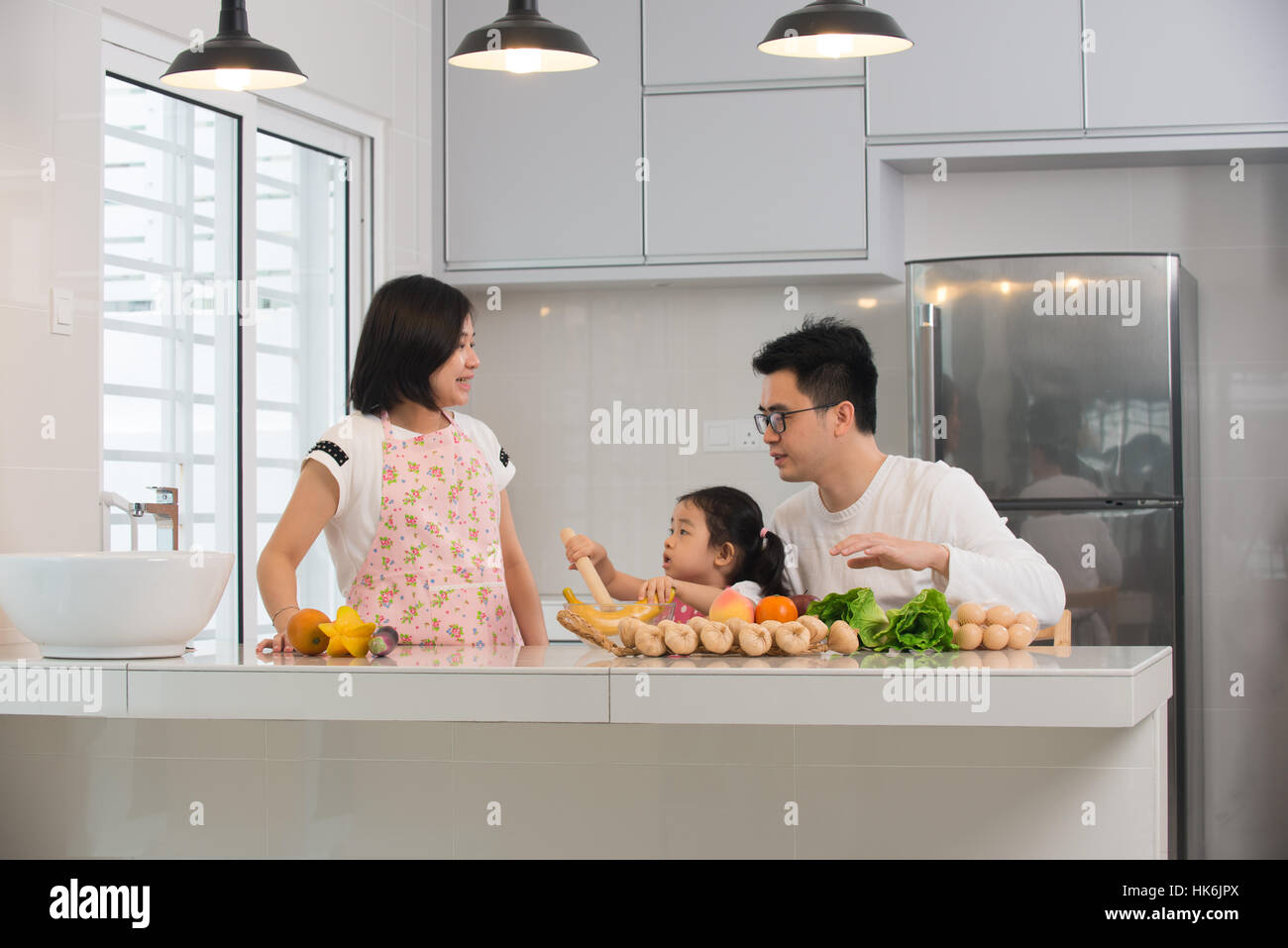 asian family cooking at kitchen Stock Photo - Alamy