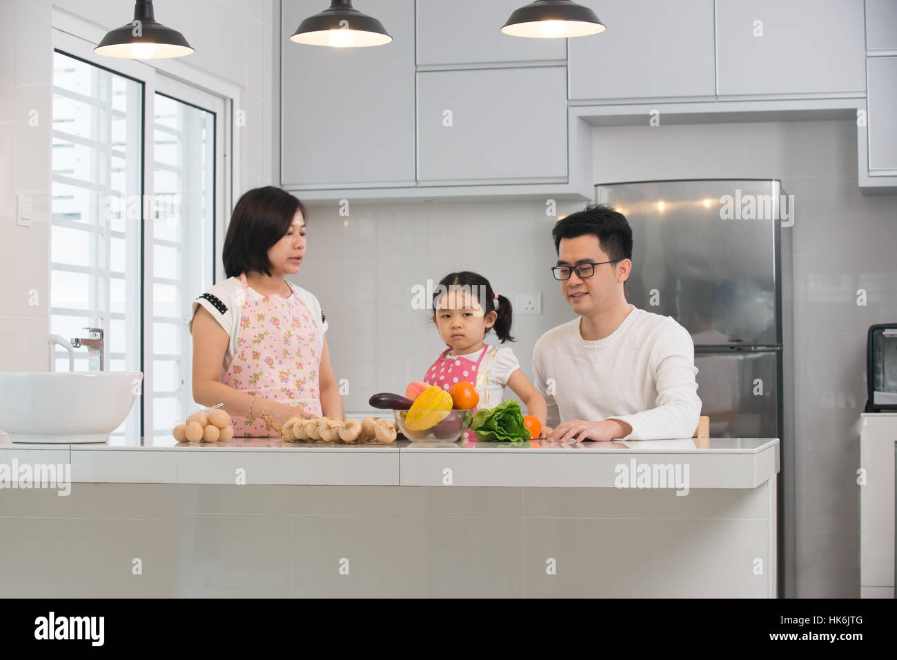 asian family cooking at kitchen Stock Photo - Alamy