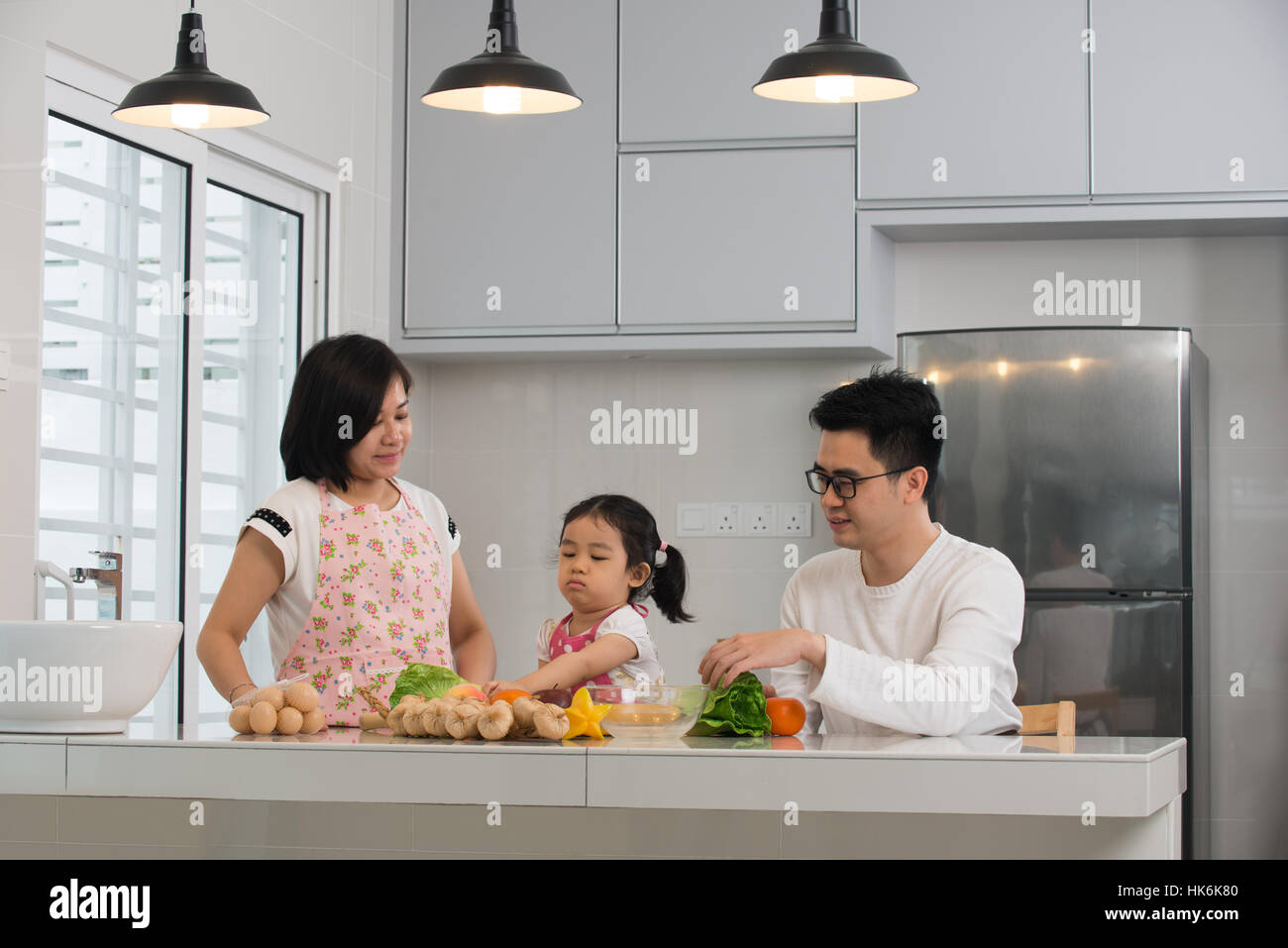 asian family cooking at kitchen Stock Photo - Alamy
