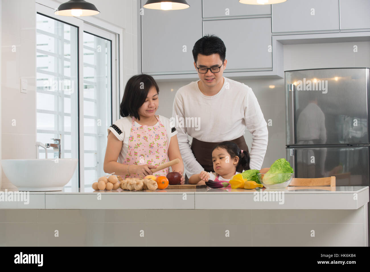asian family cooking at kitchen Stock Photo - Alamy