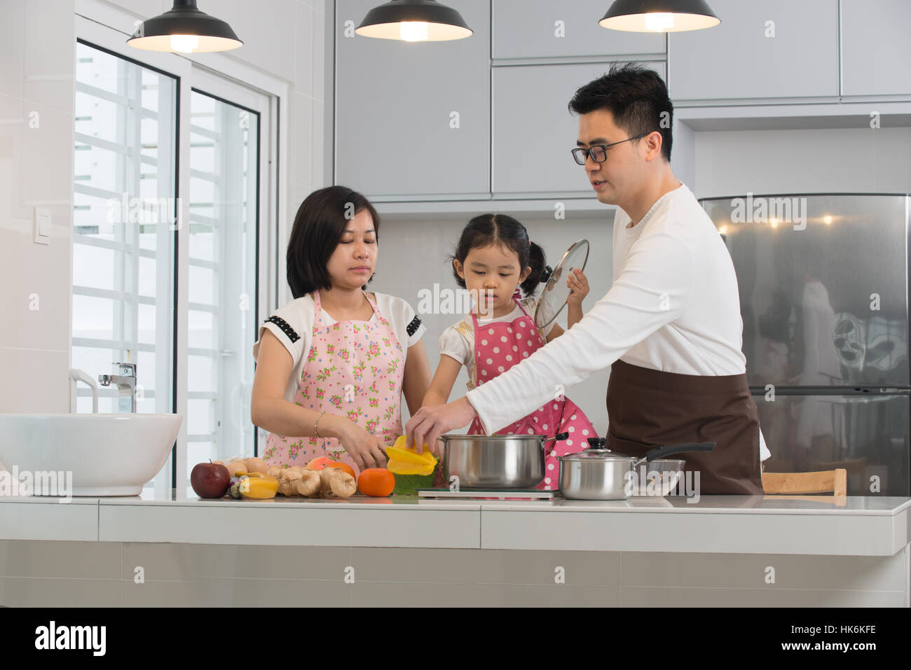 asian family cooking at kitchen Stock Photo - Alamy