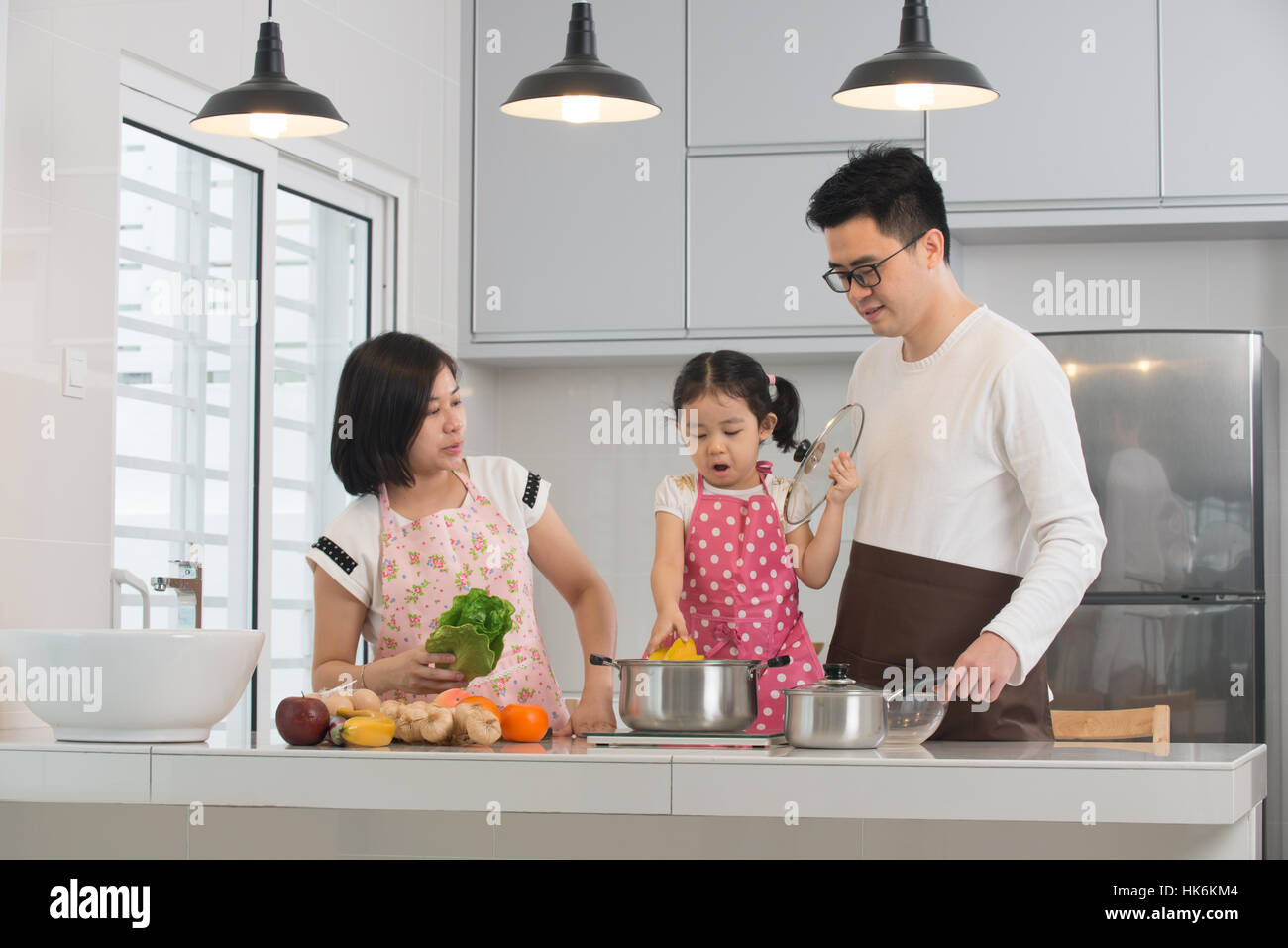 asian family cooking at kitchen Stock Photo - Alamy
