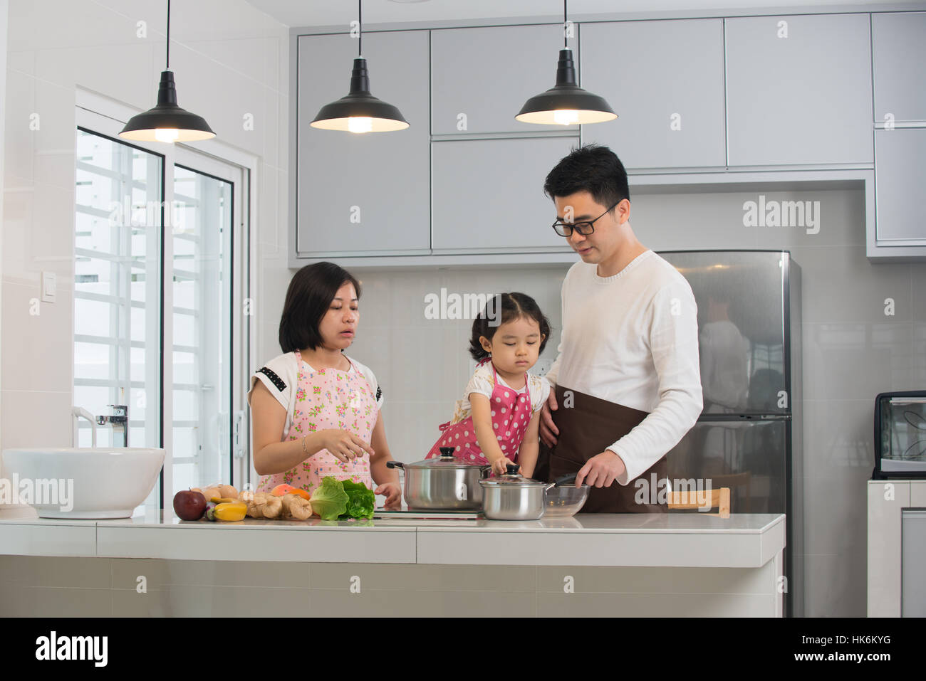 asian family cooking at kitchen Stock Photo - Alamy