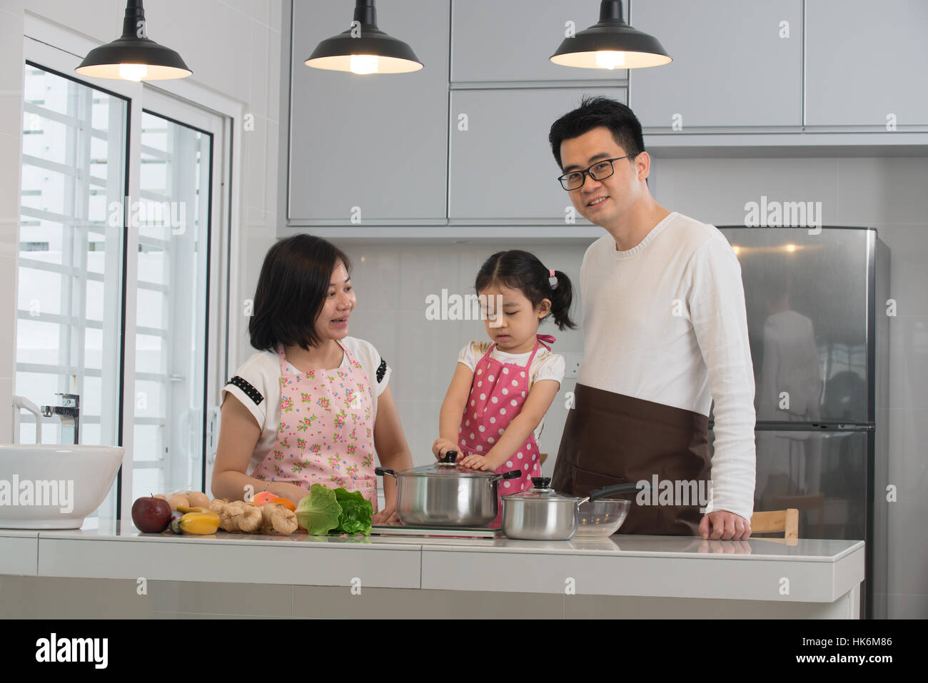 asian family cooking at kitchen Stock Photo - Alamy