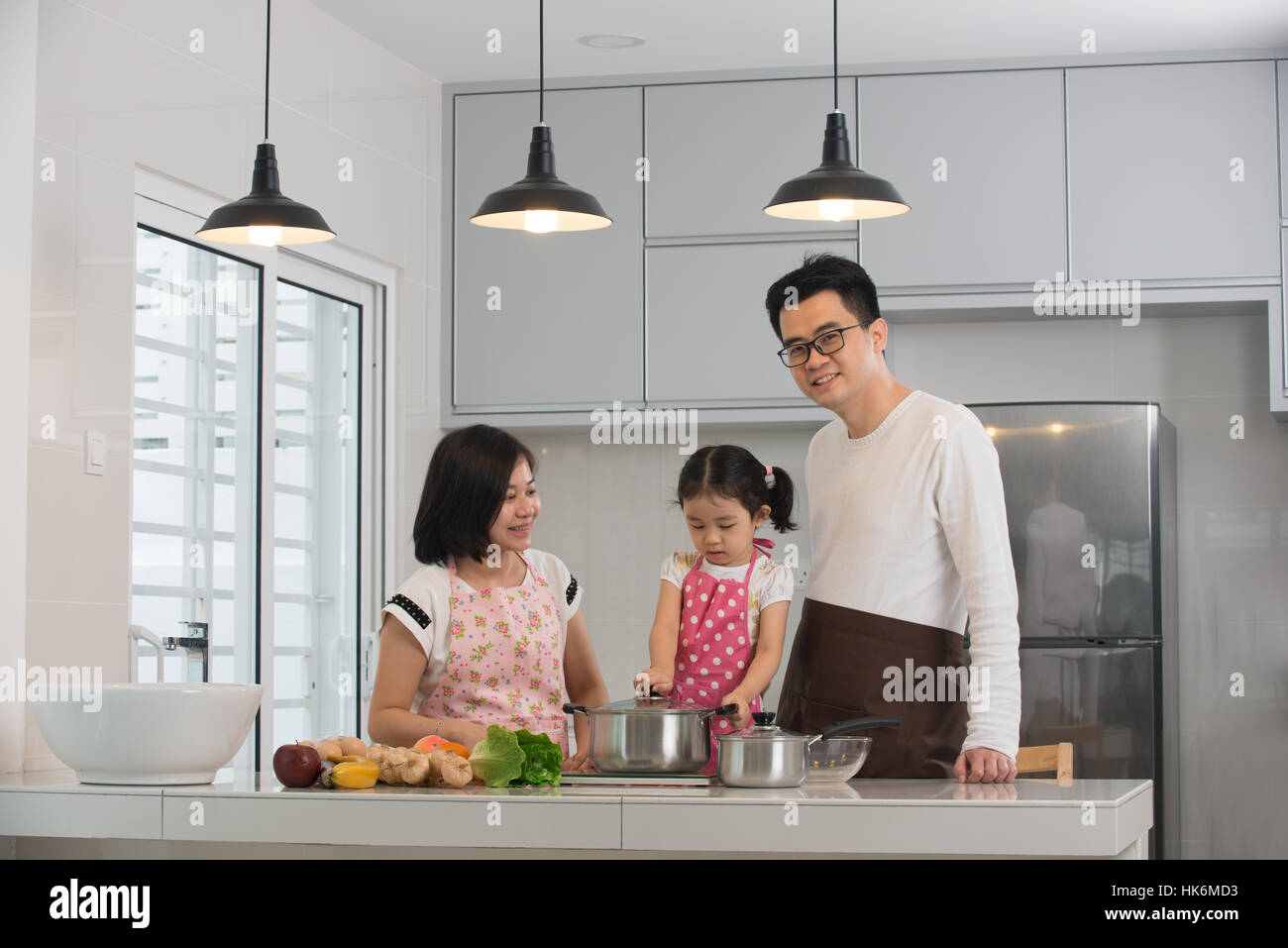 asian family cooking at kitchen Stock Photo - Alamy
