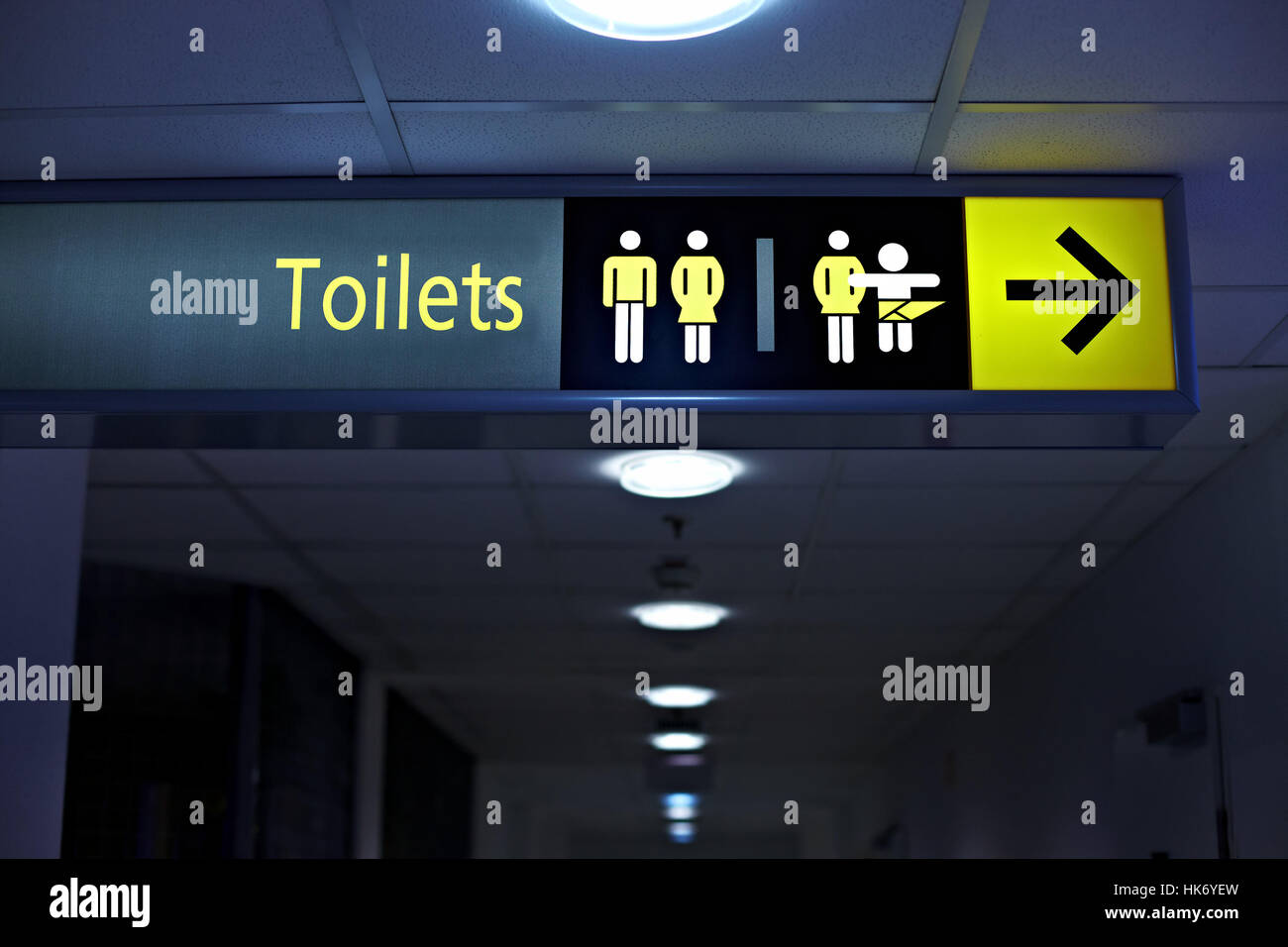Toilets sign in a building corridor Stock Photo - Alamy