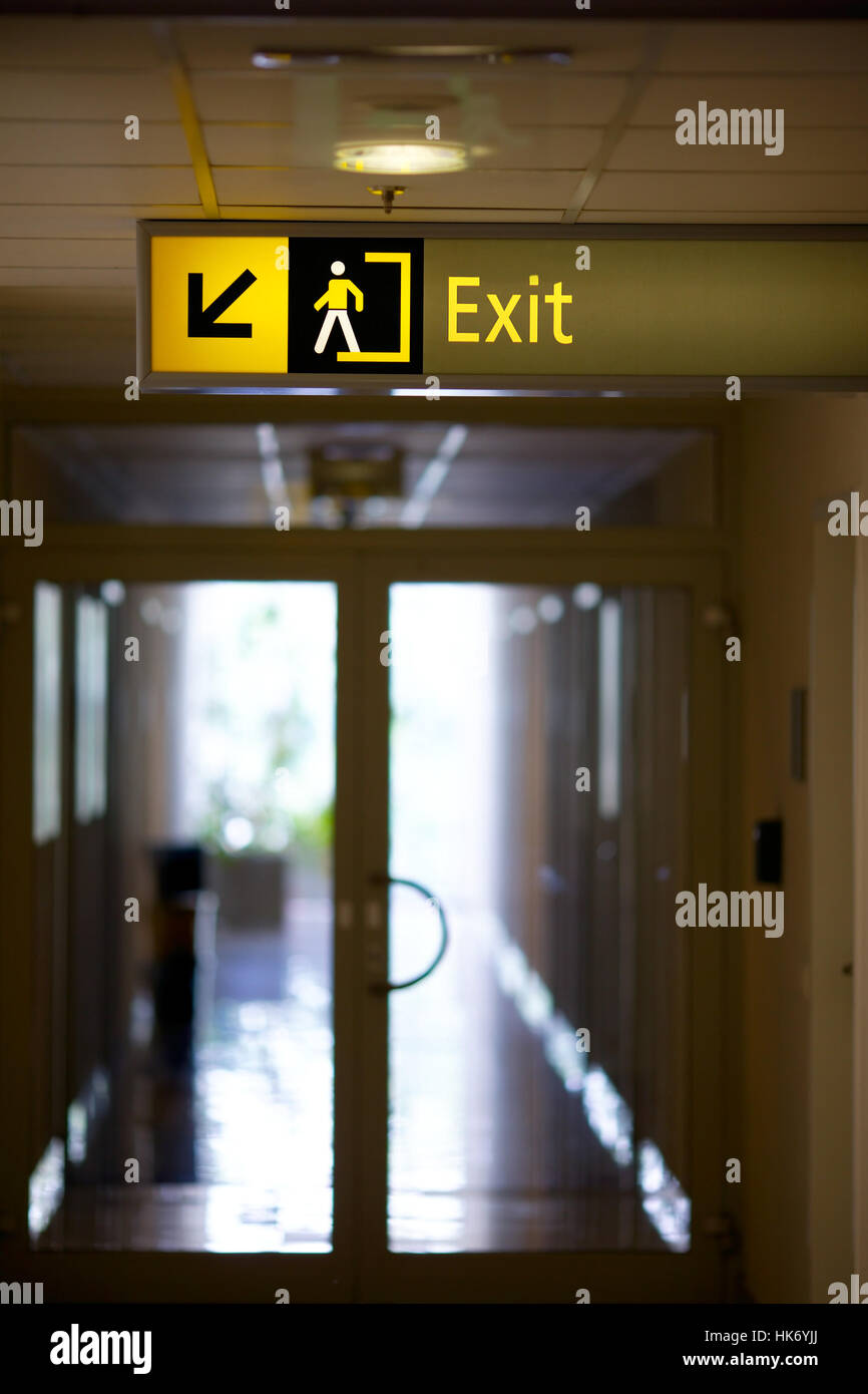 Exit sign in a corridor Stock Photo - Alamy