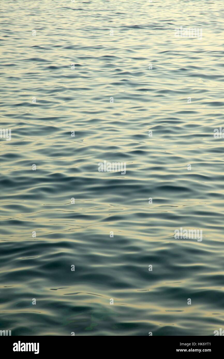 Smooth, waving water surface background Stock Photo - Alamy